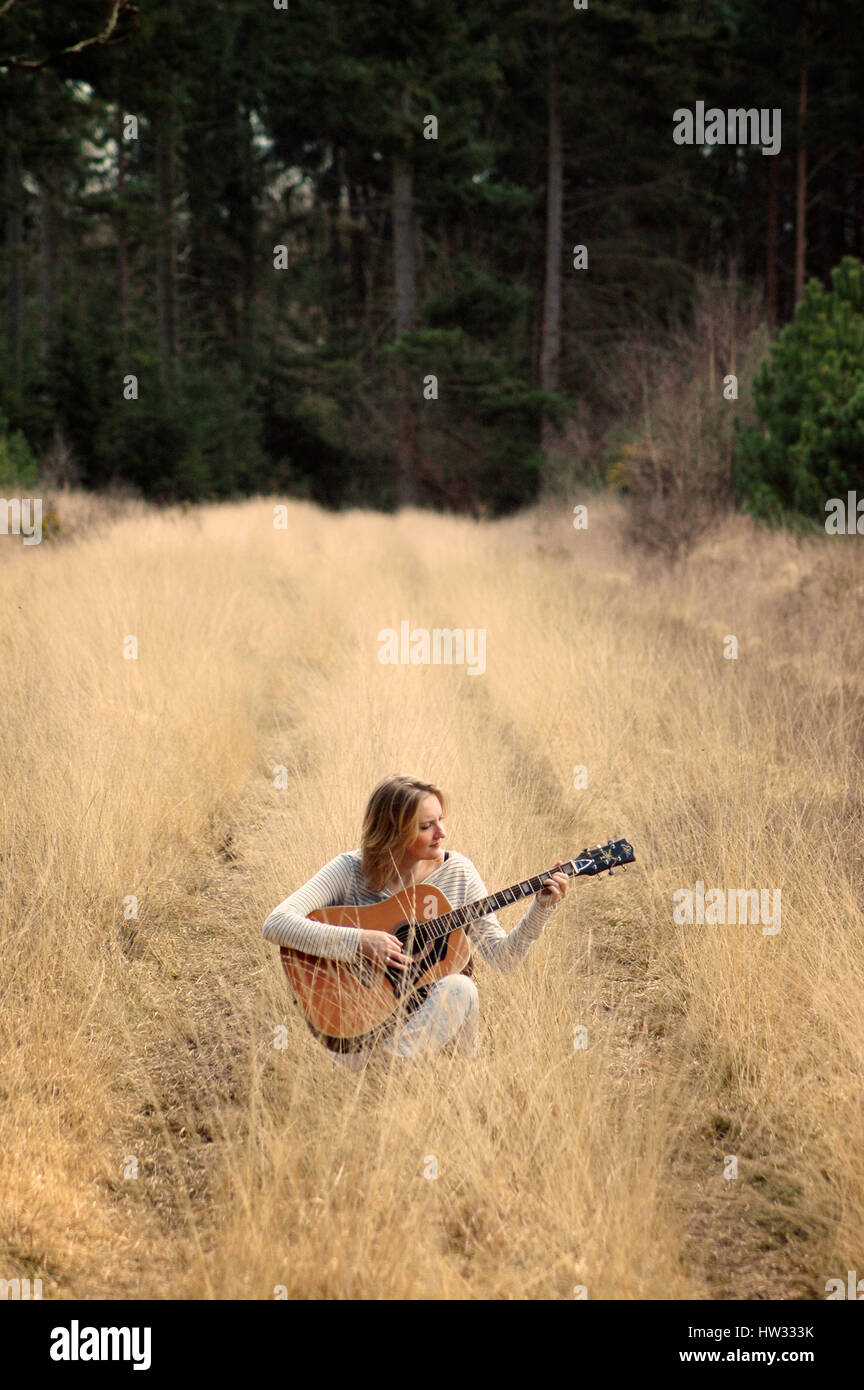 Singer Songwriter in The New Forest, Hampshire, England Stock Photo - Alamy