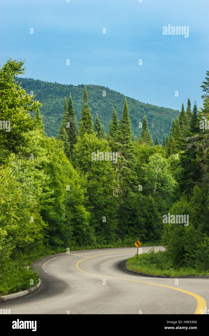 perfect turning road going through the landscape Stock Photo - Alamy