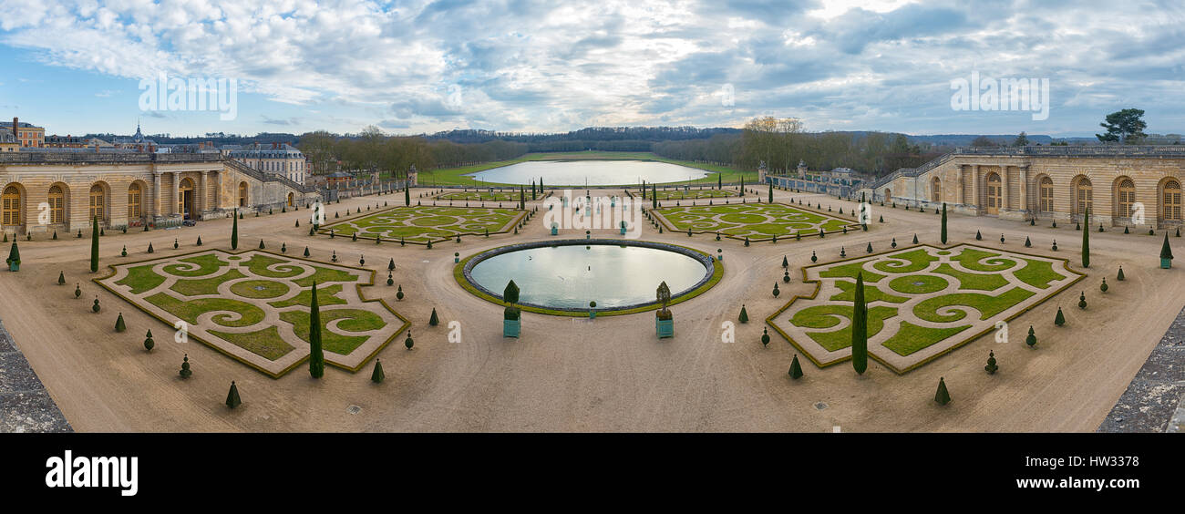 Symmetric french gardens of the Orangerie of Versailles palace in ...