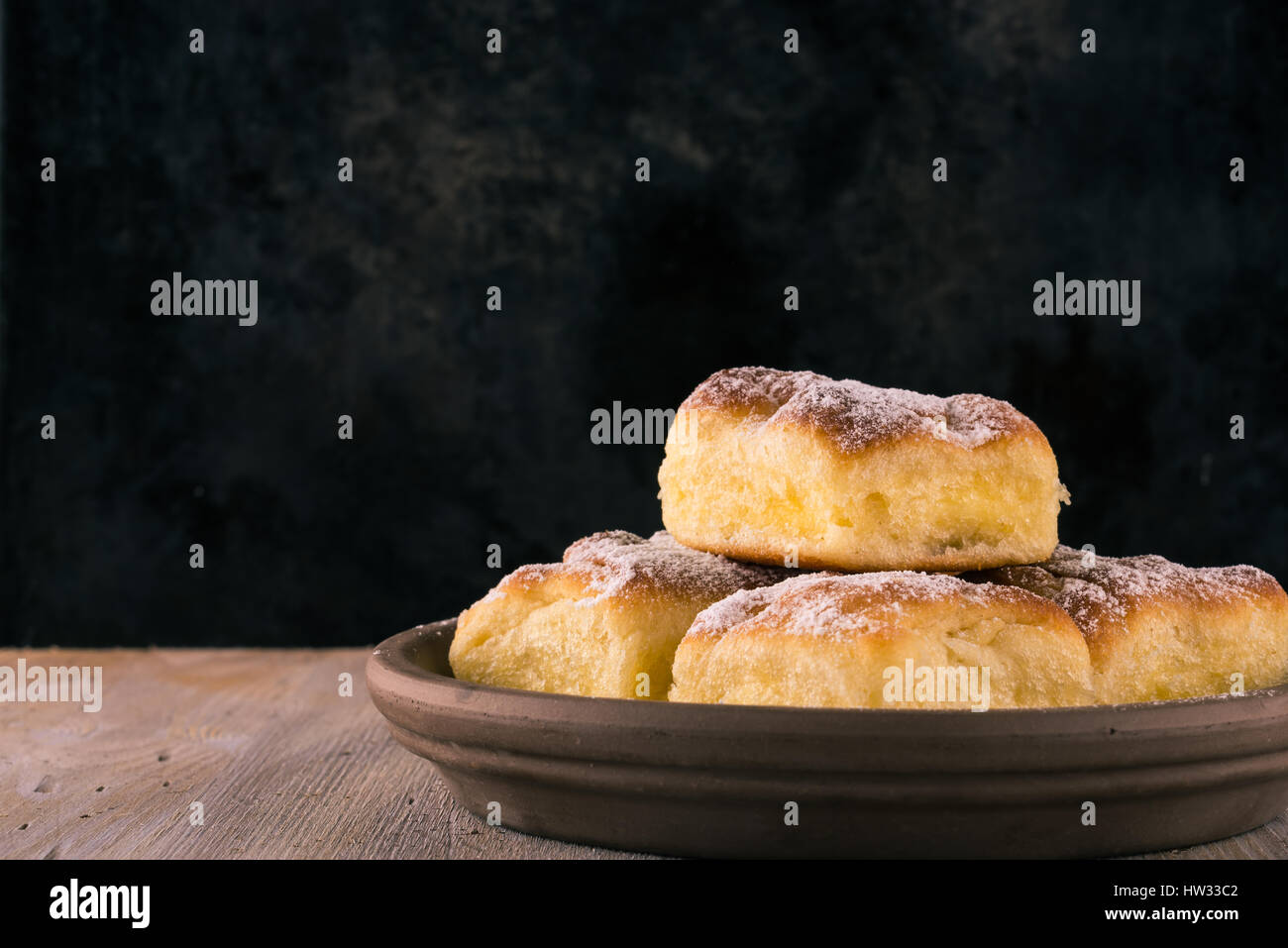 Horizontal photo of traditional rustic sweet bun cakes with cream ...