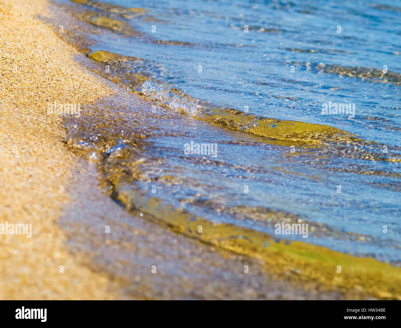 The clean sea water and the beach Stock Photo - Alamy