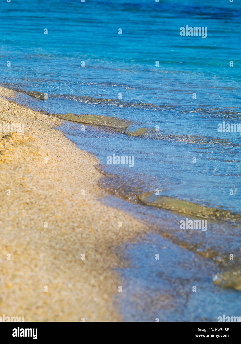 The clean sea water and a sandy beach Stock Photo - Alamy