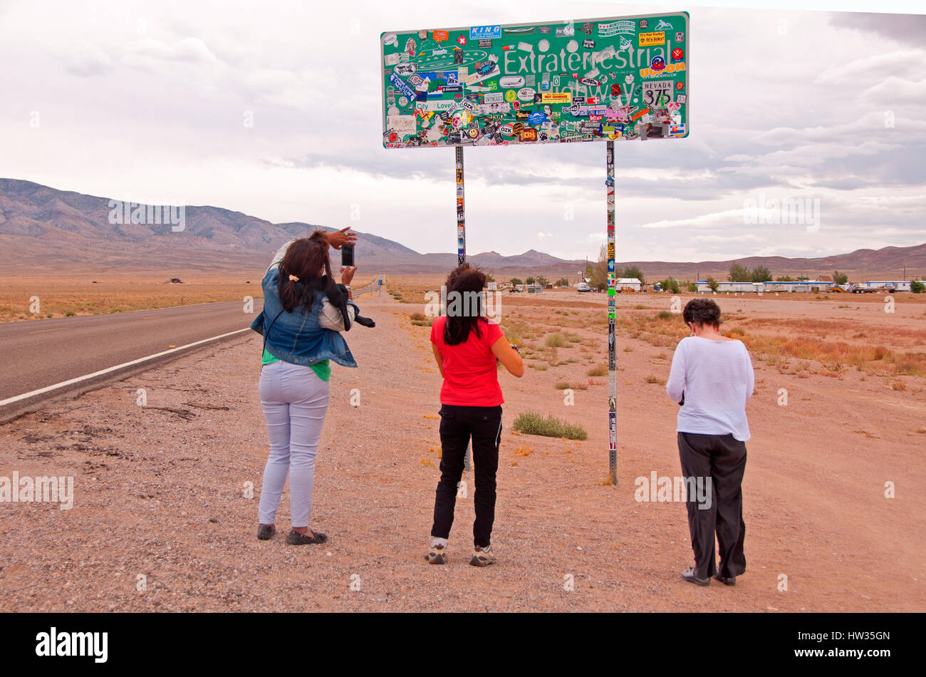 Tourists taking photographs of Extraterrestrial Highway 375 Nevada ...