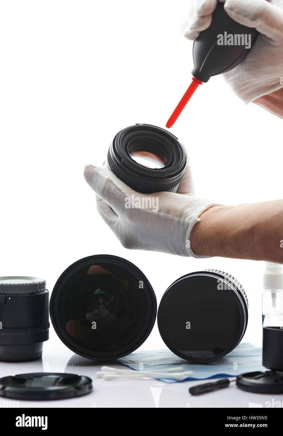 Worker cleaning photography lens isolated on white background. Close-up ...