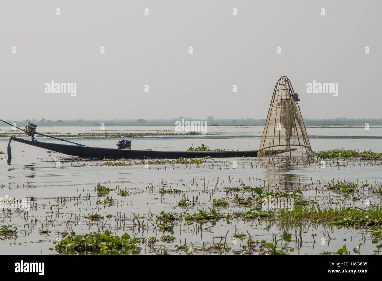 Fisherman Casting Net on Inle Lake, Myanmar Stock Photo - Alamy