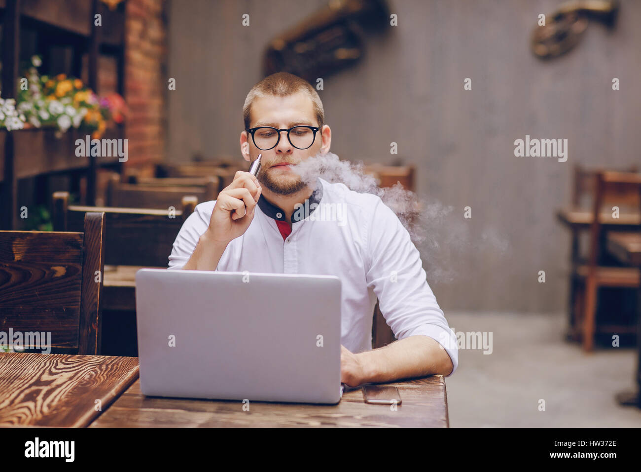 Man vaping in cafe hi-res stock photography and images - Alamy