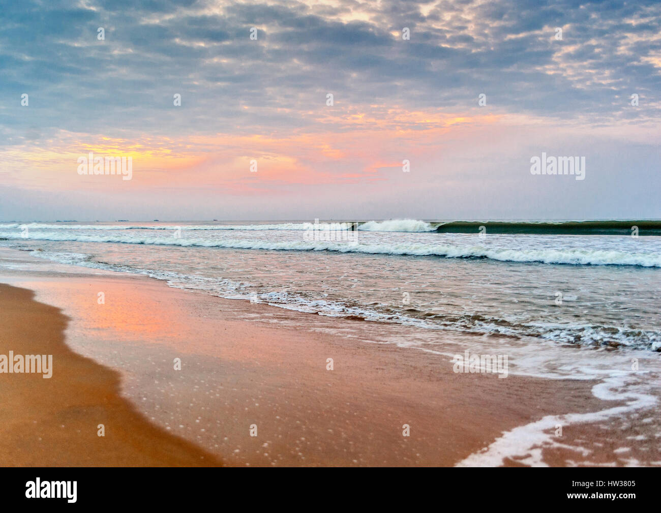 India, Goa. Early morning on the beach Colva. Rising sun illuminates ...
