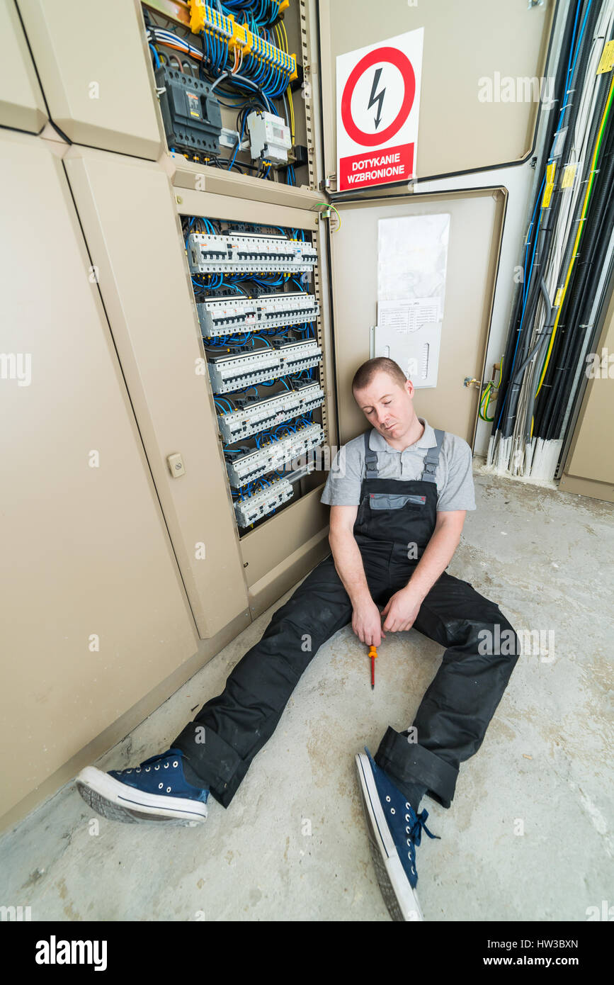 electrician electrocuted lying on the ground Stock Photo - Alamy