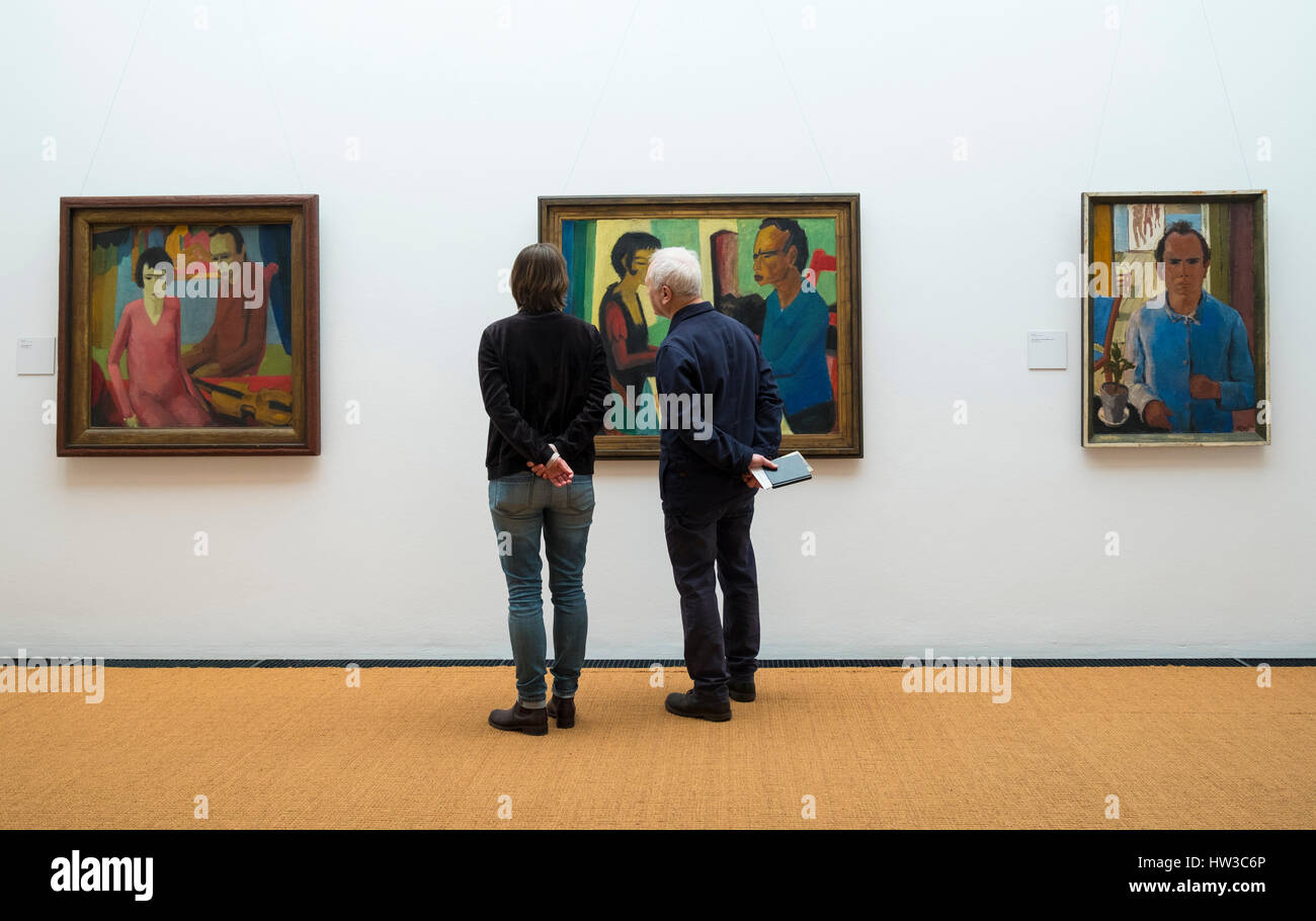 Visitors looking at paintings by Max Kaus at Brucke Museum in Dahlem ...