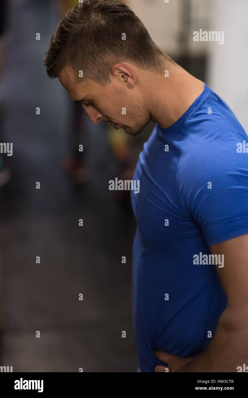 Portrait of a young muscular fitness trainer at the gym Stock Photo - Alamy