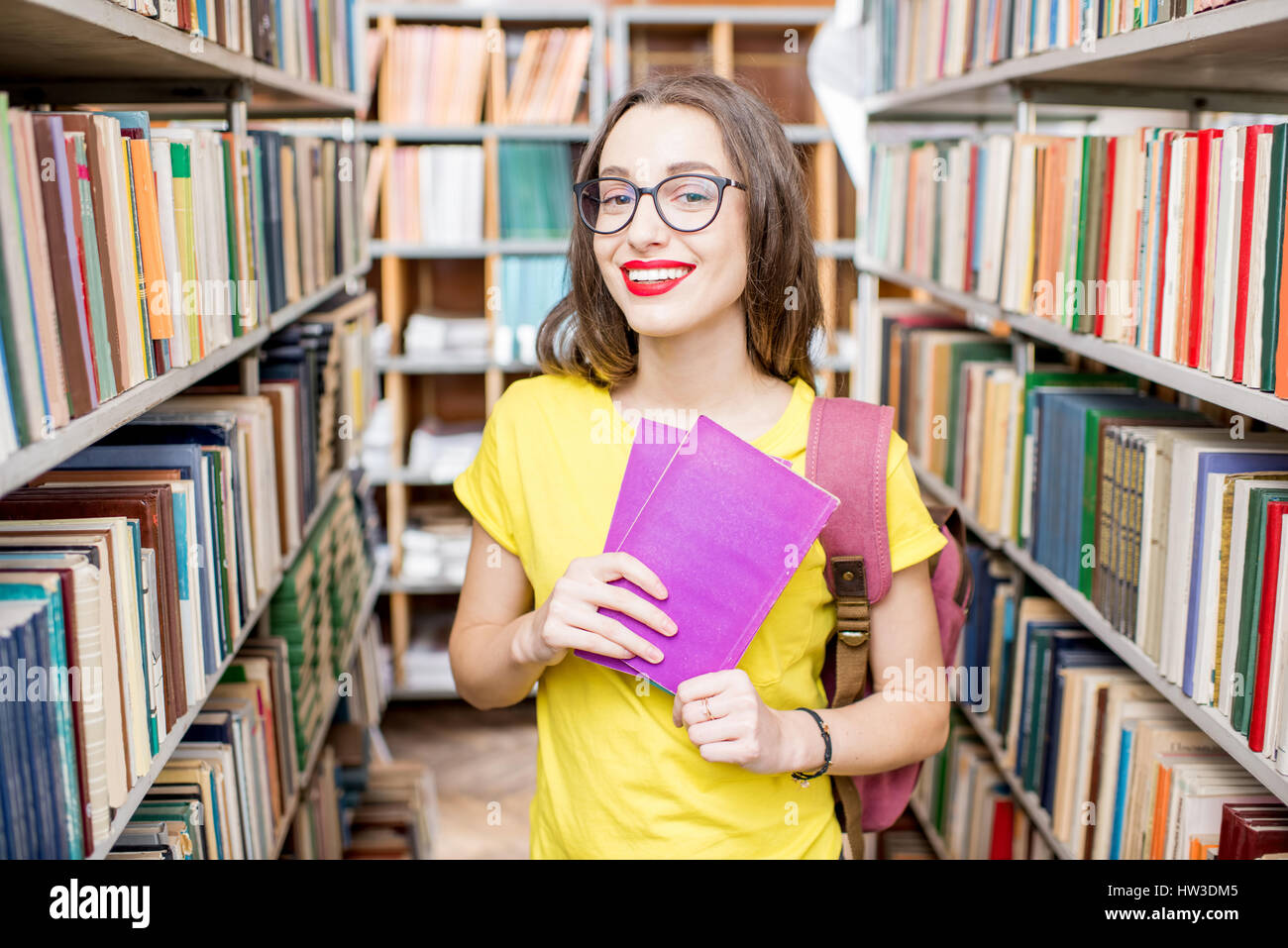 Student at the library Stock Photo - Alamy