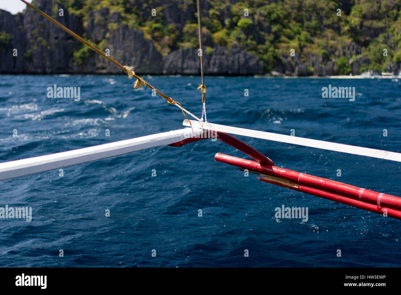 The out rigger of a traditional Filipino pump boat sailing though the ...