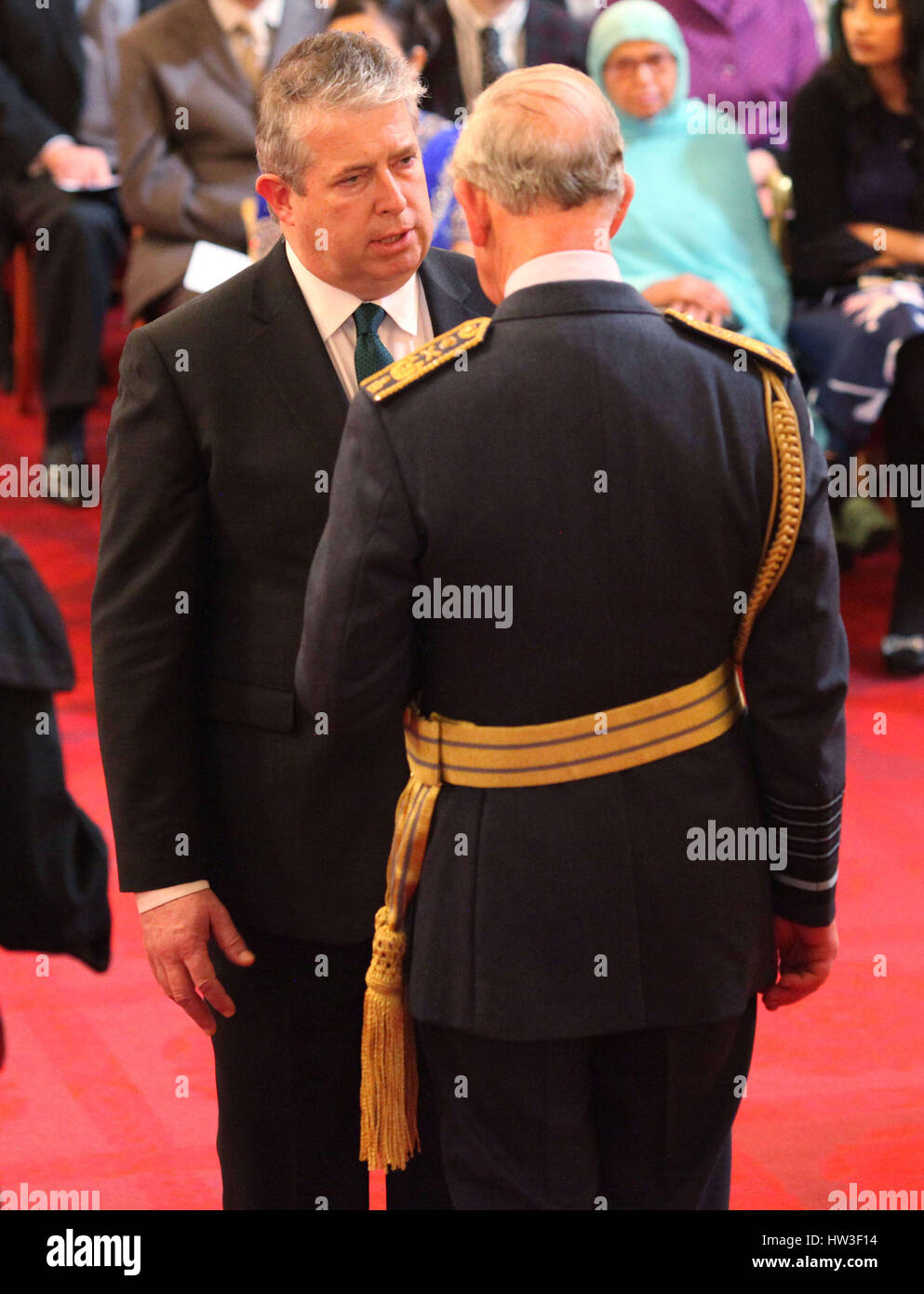 Dr David Hegarty is made an MBE by the Prince of Wales during an ...