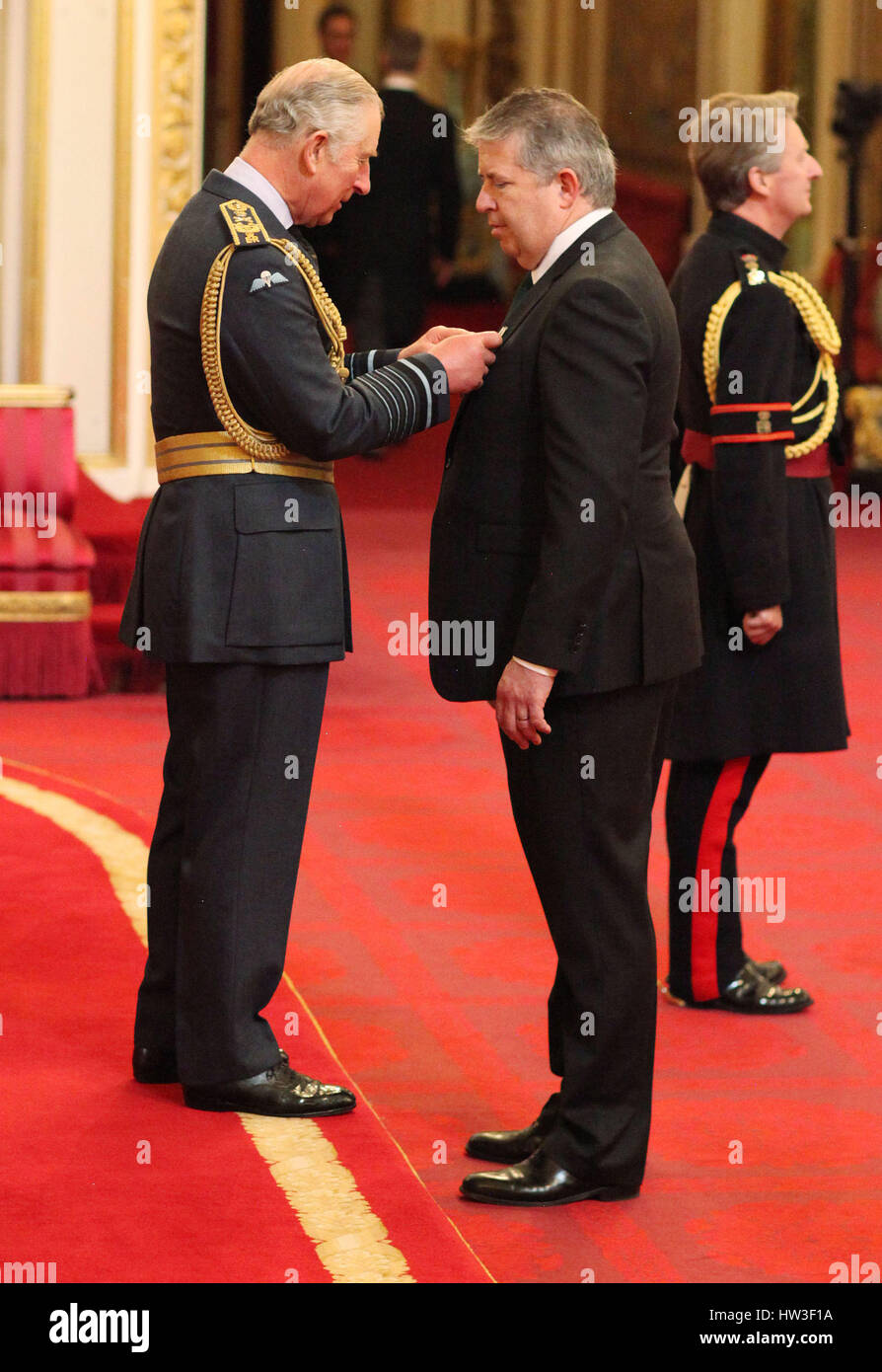 Dr David Hegarty is made an MBE by the Prince of Wales during an ...