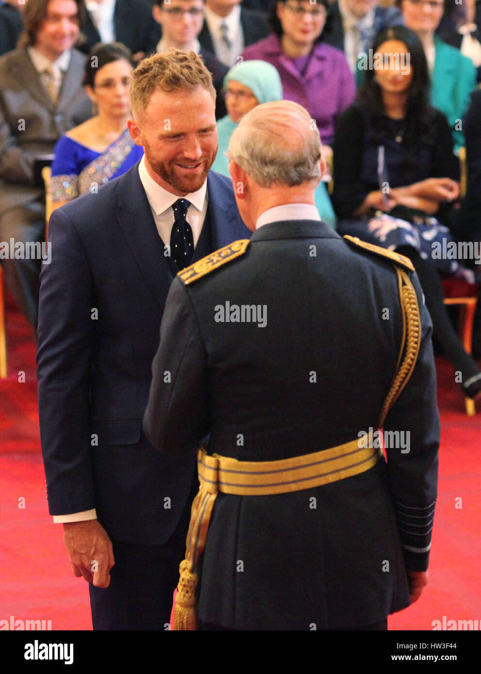 Rower William Satch is made an MBE by the Prince of Wales during an ...