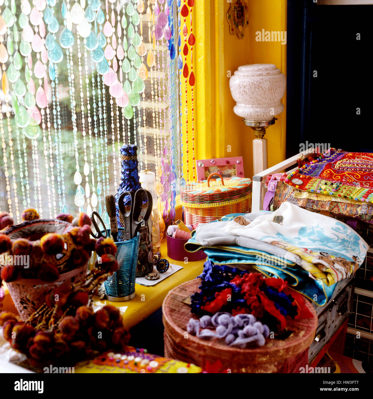 Beaded curtain and side table Stock Photo - Alamy