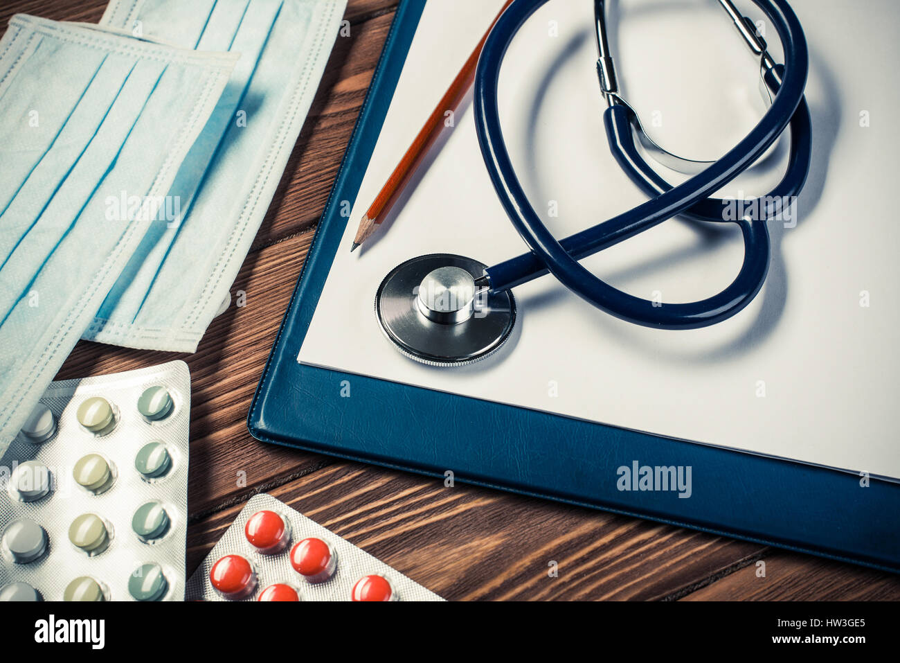 Desk of doctor with medicine things Stock Photo - Alamy