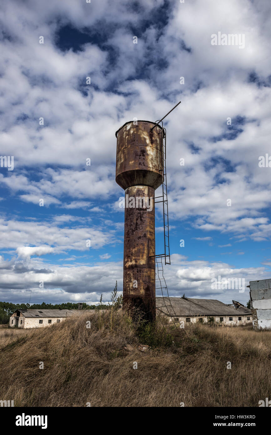 Water tower and pig houses of kolkhoz in abandoned Mashevo village of ...
