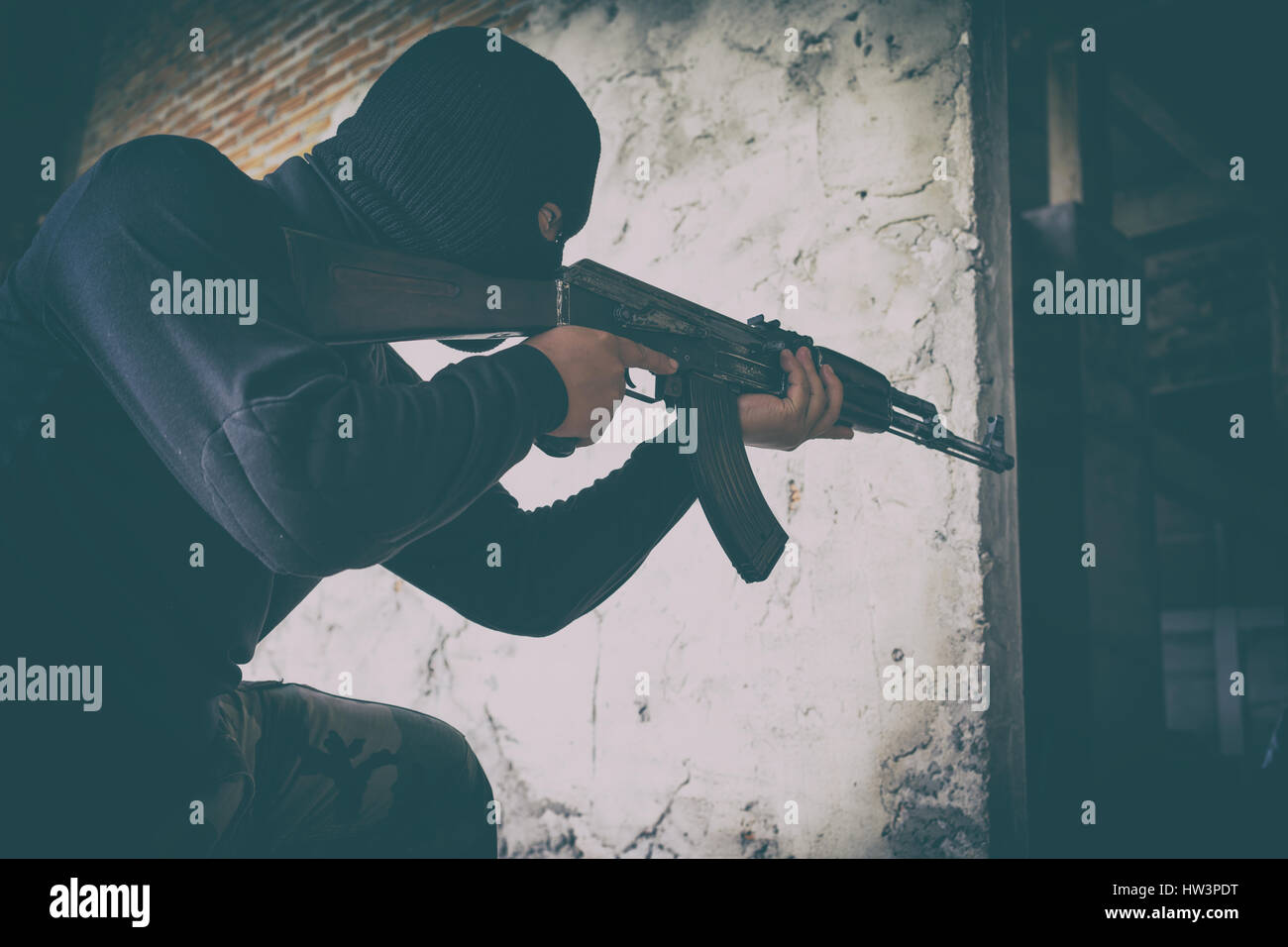terrorist in black uniform and mask with kalashnikov ak47 Stock Photo ...