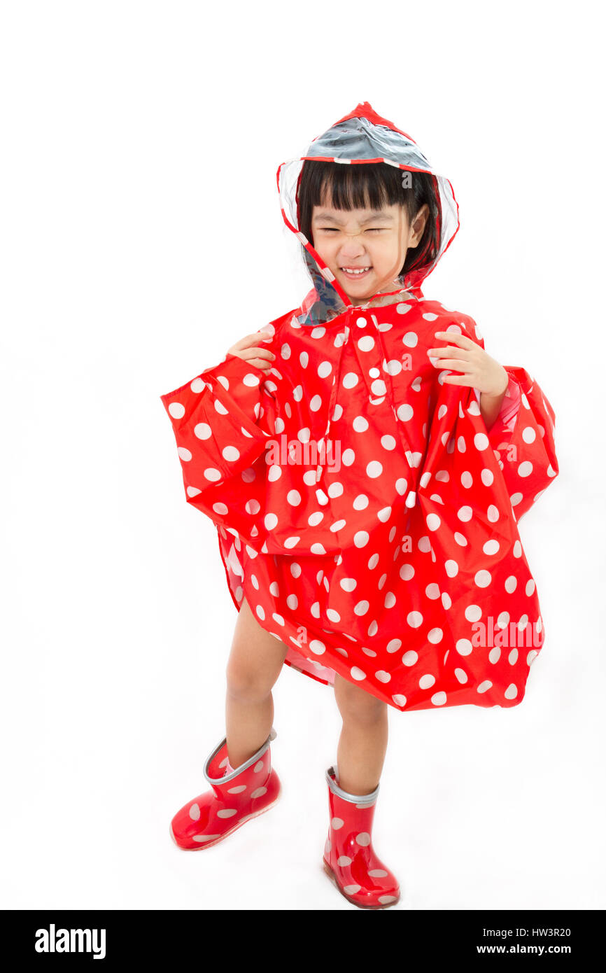 Chinese Little Girl Wearing raincoat and Boots in plain white isolated ...