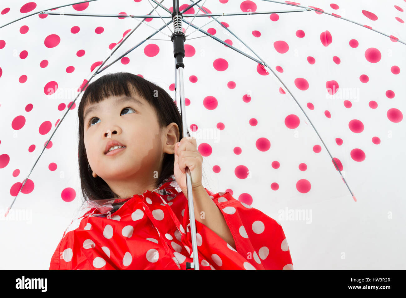 Chinese Little Girl Holding umbrella with raincoat in plain white ...