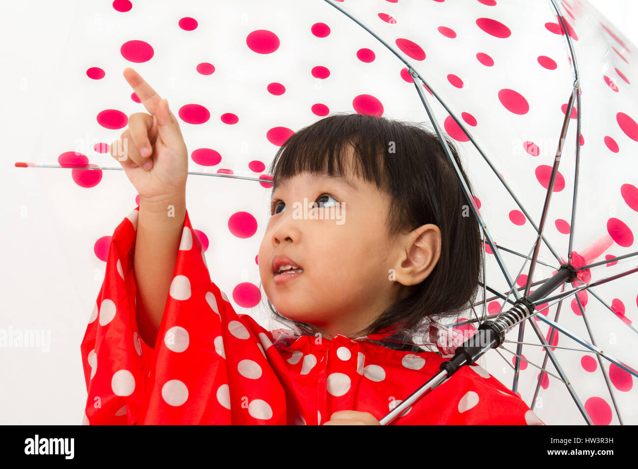 Chinese Little Girl Holding umbrella with raincoat in plain white ...