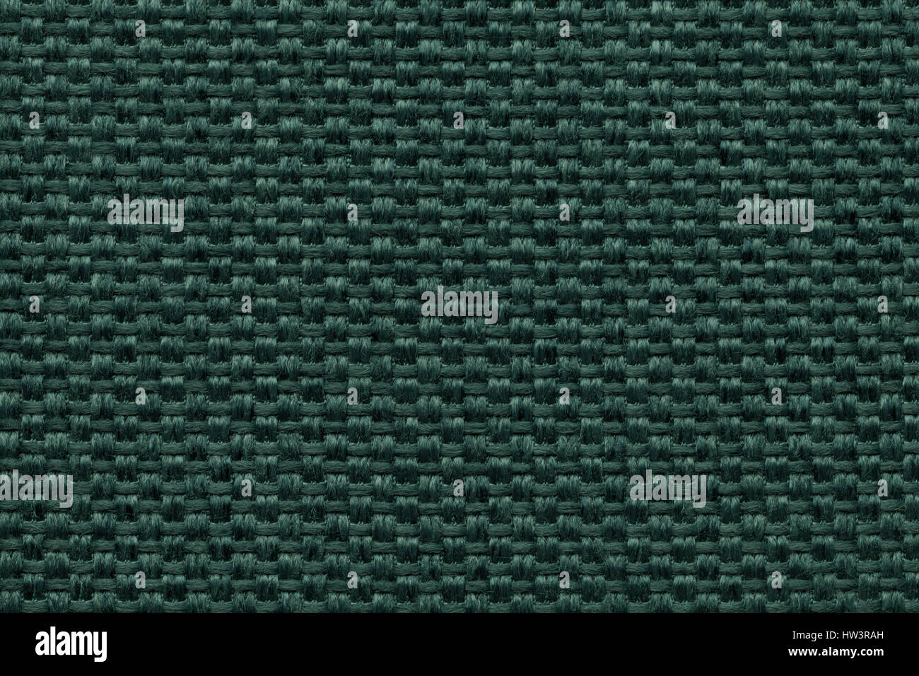 Dark green background with checkered pattern, closeup. Structure of the ...