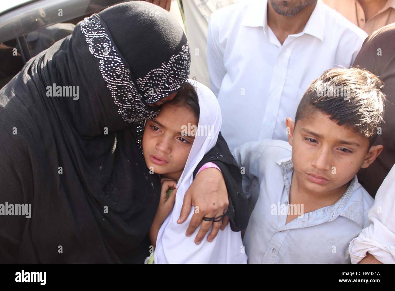 Karachi, Pakistan. 17th Mar, 2017. Relatives of Saeed Shah are holding ...
