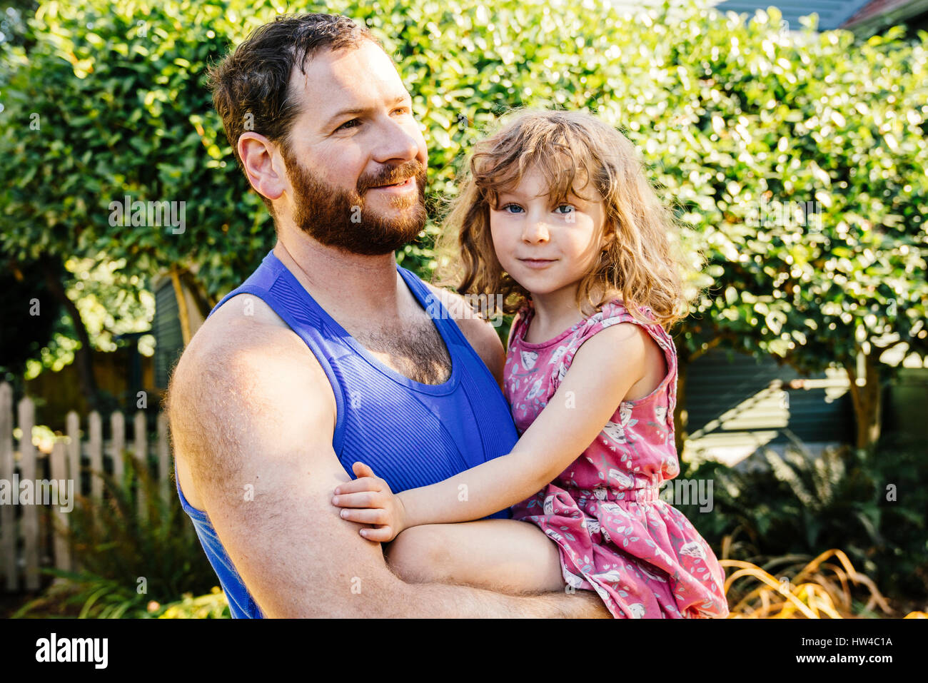 Portrait of Caucasian father carrying daughter Stock Photo - Alamy