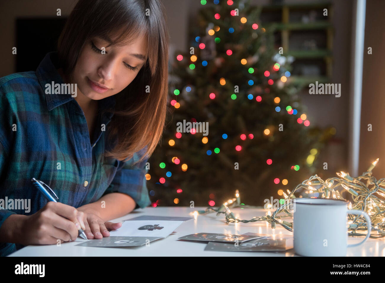 Woman writing new years card hi-res stock photography and images - Alamy