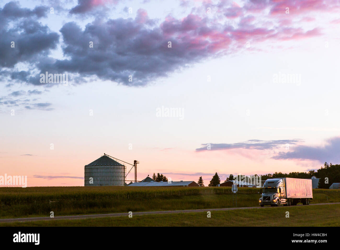 Colorful sunset over farm in rural landscape Stock Photo - Alamy