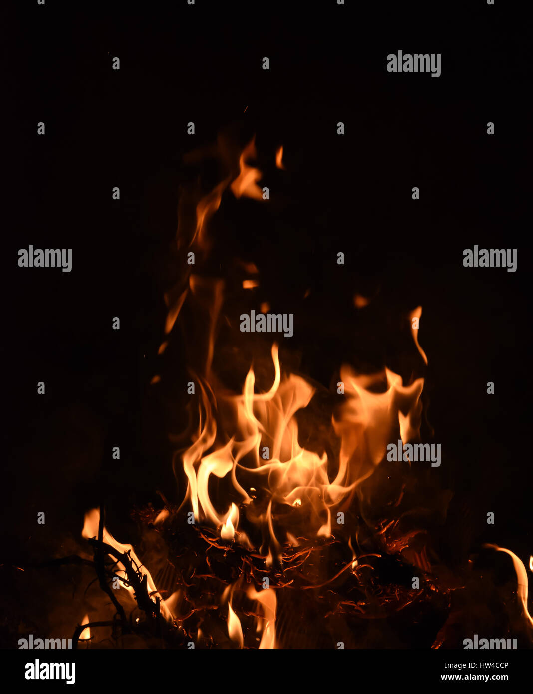 Burning fire background detail on black background Stock Photo - Alamy