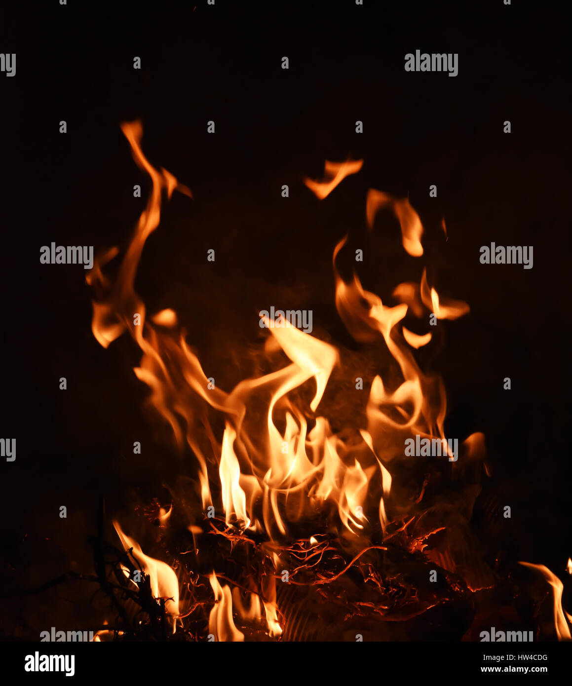 Burning fire background detail on black background Stock Photo - Alamy