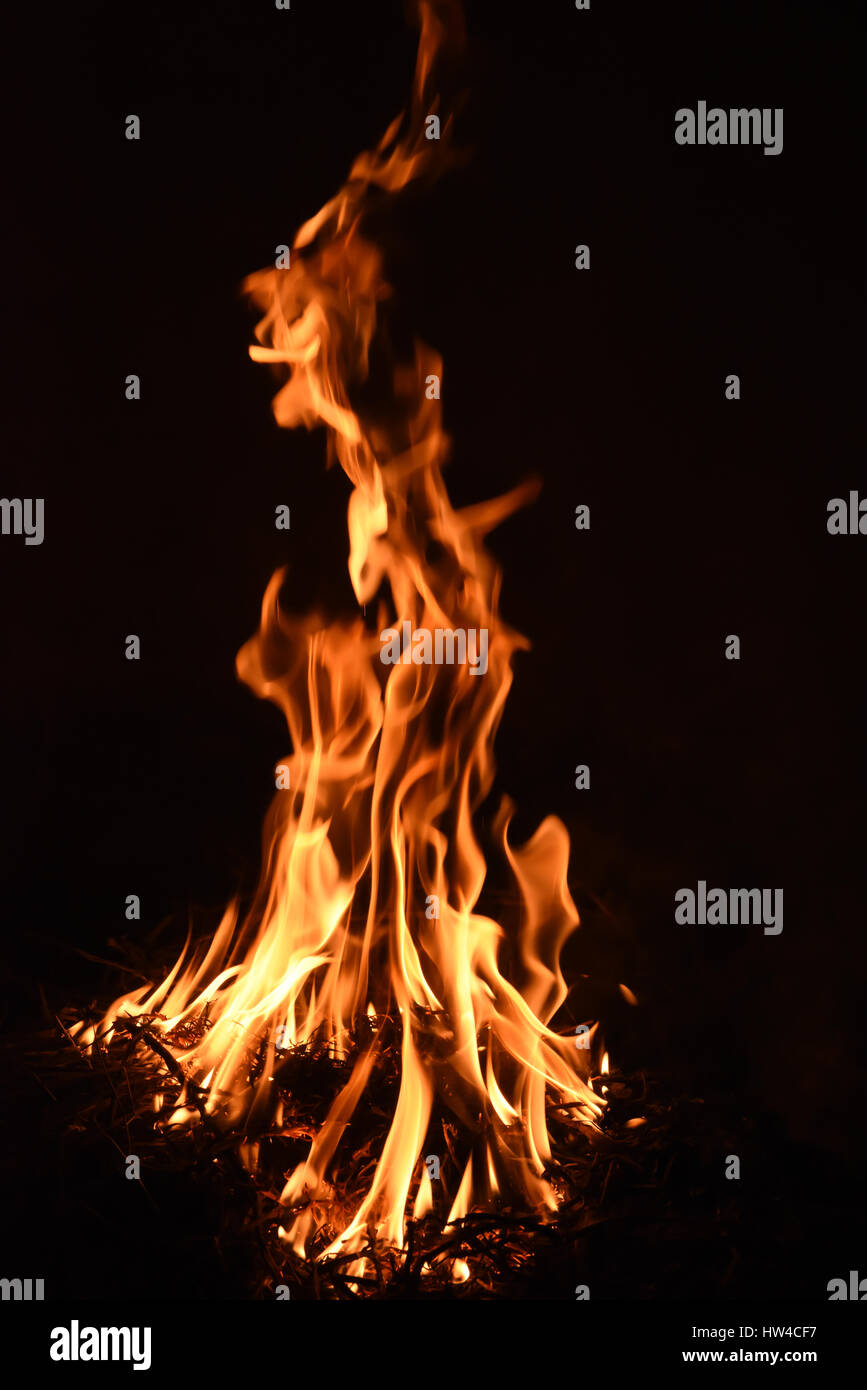 Burning fire background detail on black background Stock Photo - Alamy