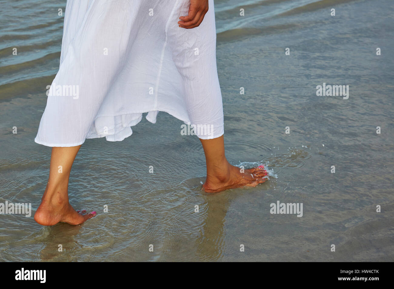 Barefoot feet in water hi-res stock photography and images - Alamy