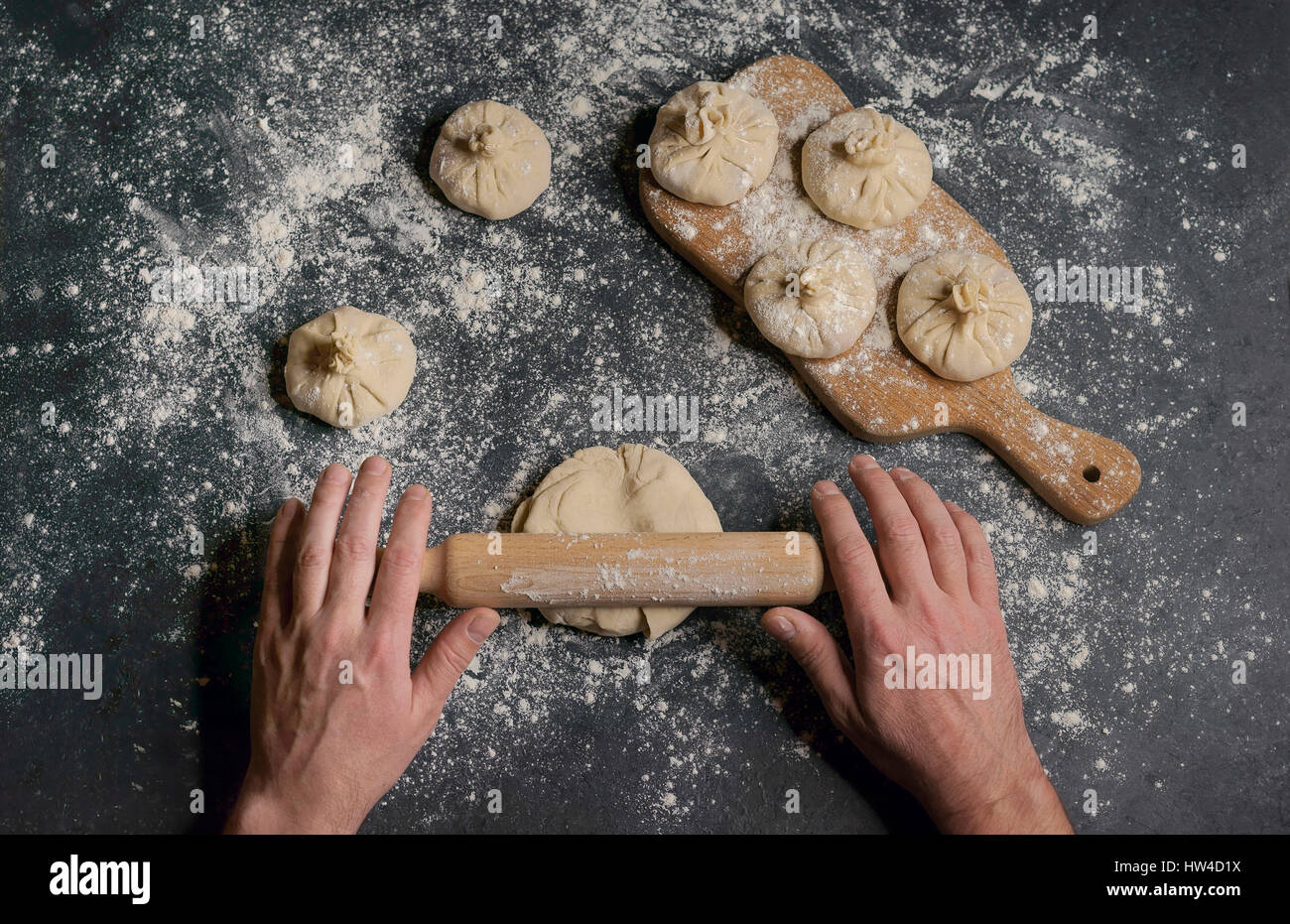 Hands of Caucasian man using rolling pin on dough Stock Photo - Alamy