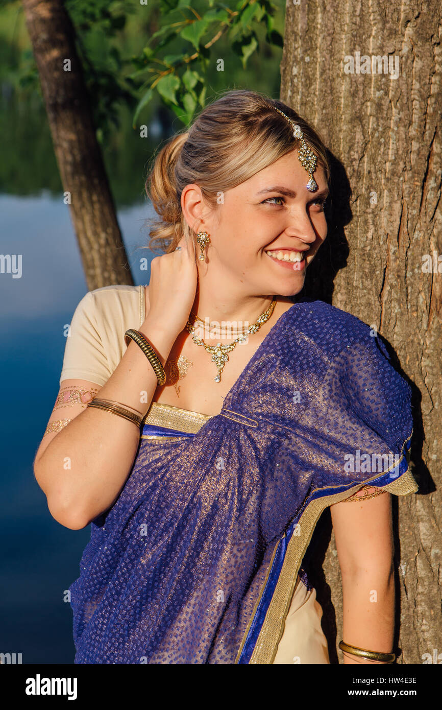Beautiful european woman in traditional indian sari near the lake Stock ...