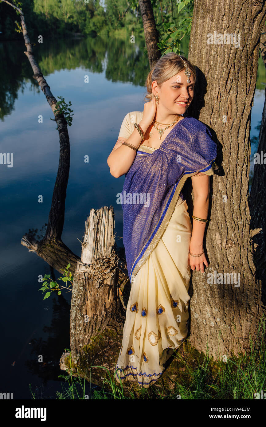 Beautiful european woman in traditional indian sari near the lake Stock ...