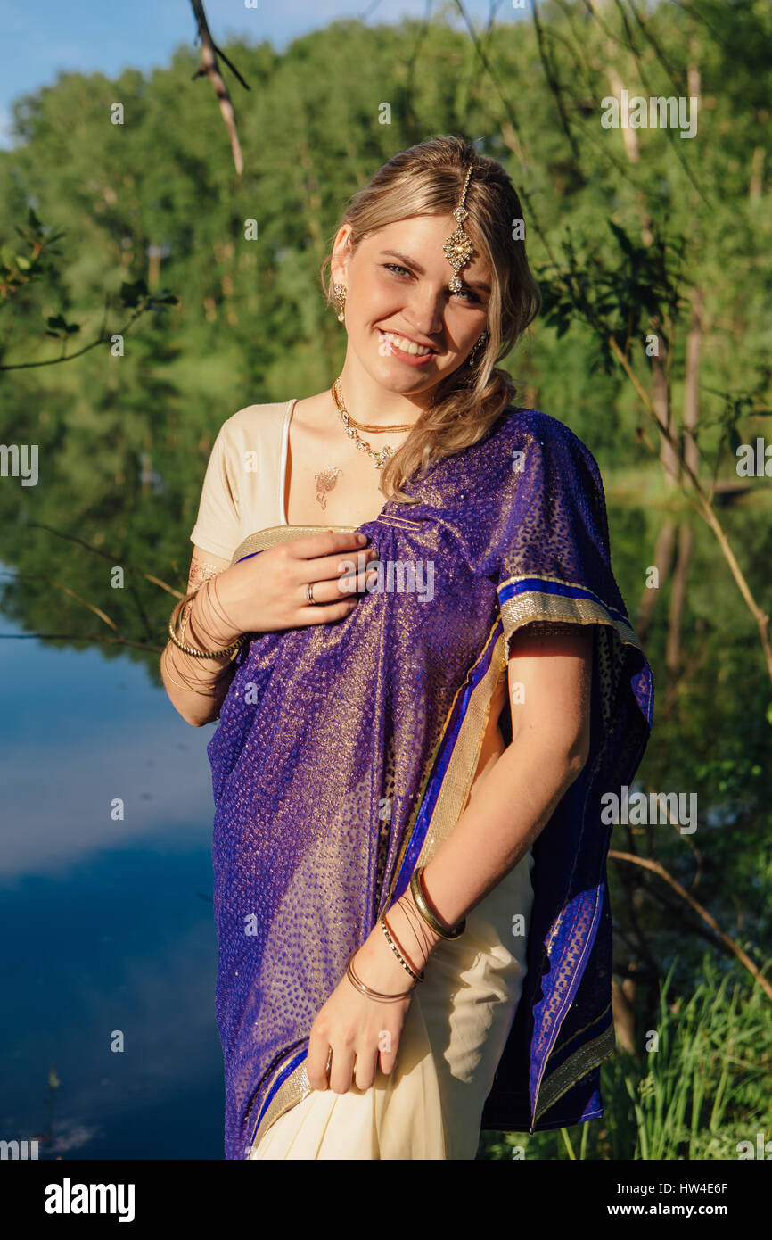 Beautiful european woman in traditional indian sari near the lake Stock ...