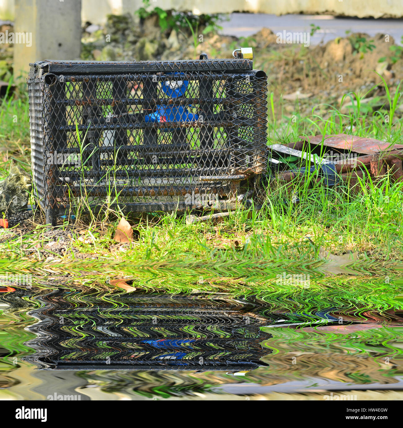 Water meter supply in steel cage near river Stock Photo - Alamy
