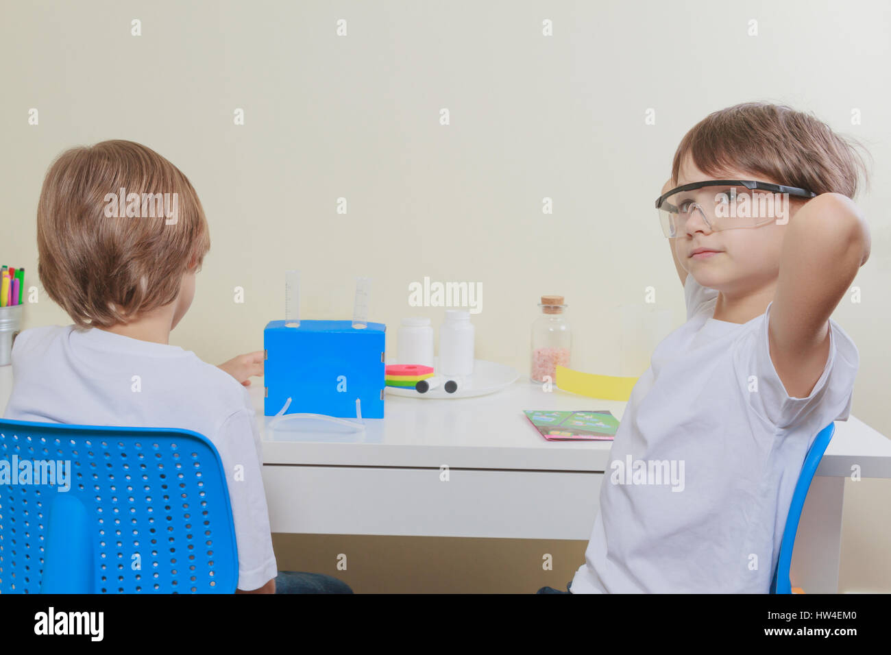 Boys making science experiments at home. Education concept Stock Photo ...