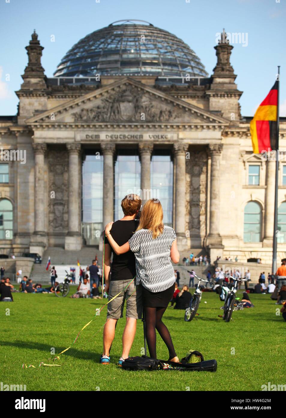 Two young German tourists are seen in front of the Reichstag in central ...