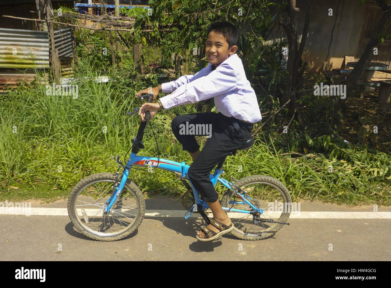 Laos Biking February 2017 boy child bicycle | usage worldwide Stock ...