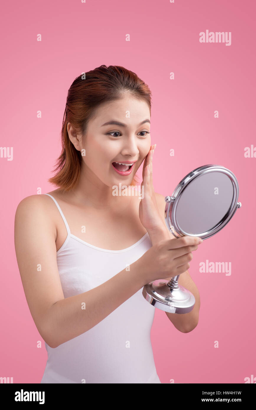 Face of young beautiful healthy asian woman and reflection in the ...