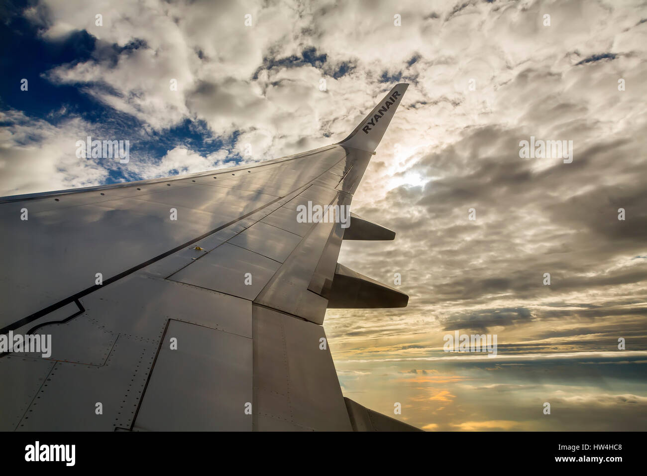 View of airplane wing through window Stock Photo - Alamy