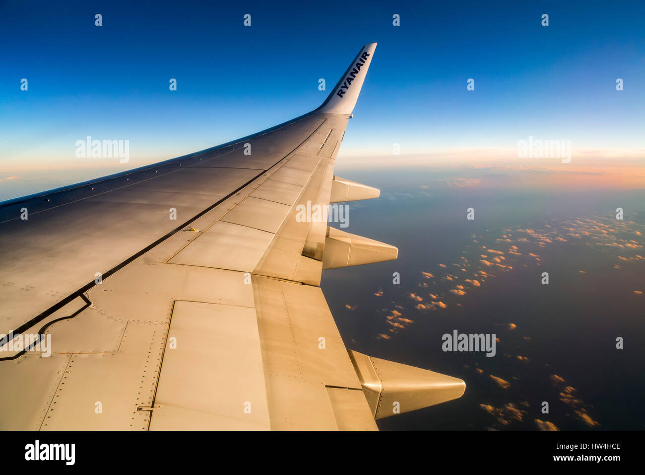 View of airplane wing through window Stock Photo - Alamy