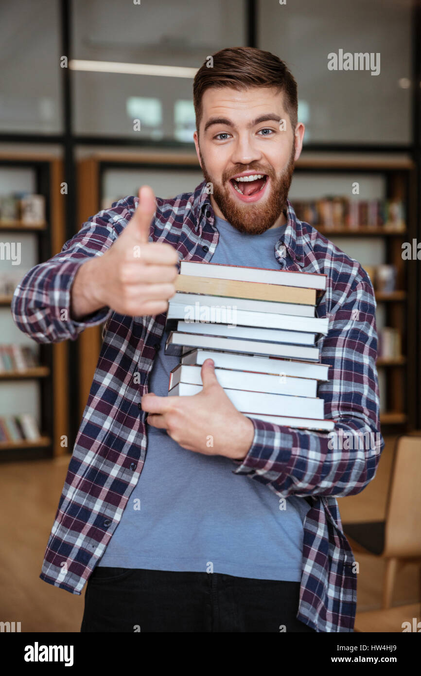 Holding books in library hi-res stock photography and images - Alamy