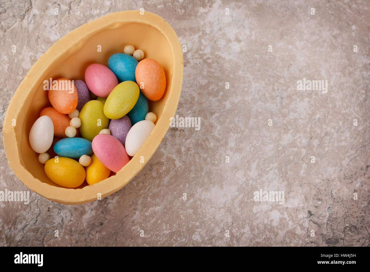 White chocolate egg for Easter on wooden background. Selective focus ...