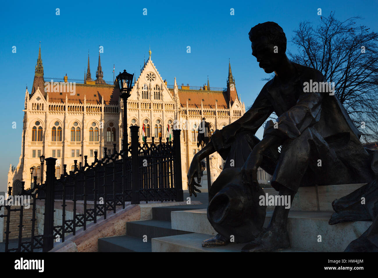 Statue of Josef Attila in front of the Parlament building in Neogothic ...