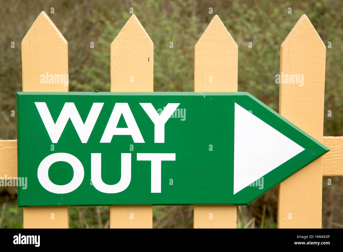 Old Way Out Sign on Wooden Fence Stock Photo - Alamy
